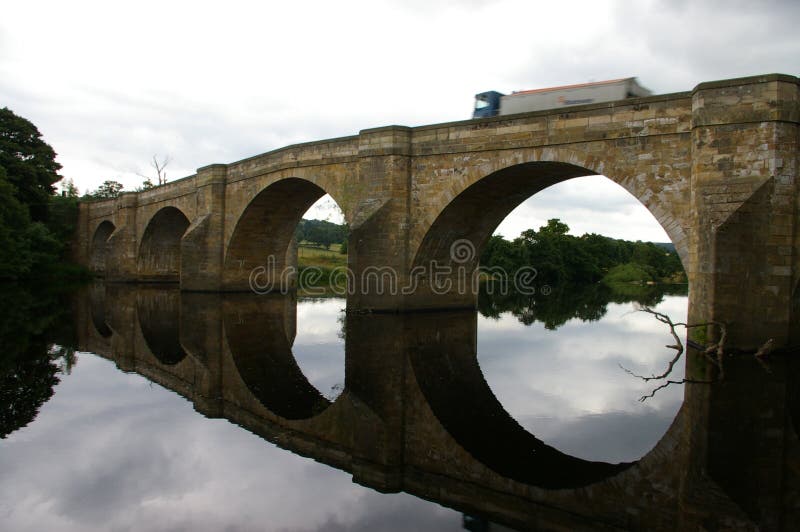Truck driving over bridge stock image. Image of mirror - 580455
