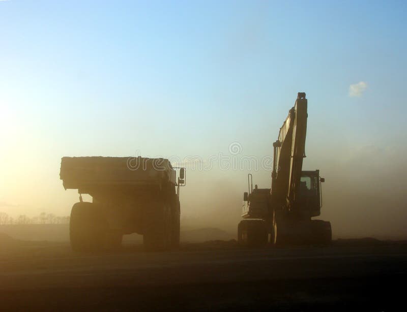 Truck and Excavator on Dusty Construction Site Stock Image - Image of ...
