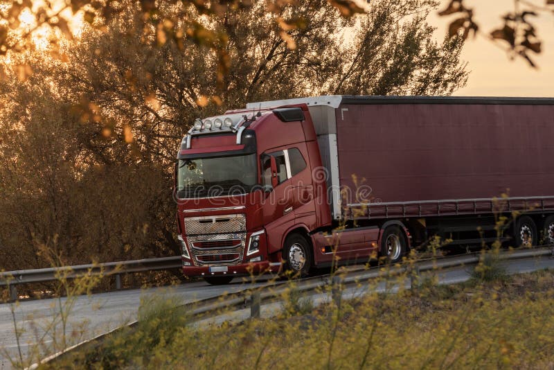 Truck Going Down a Slope between Trees Stock Photo - Image of trucking ...