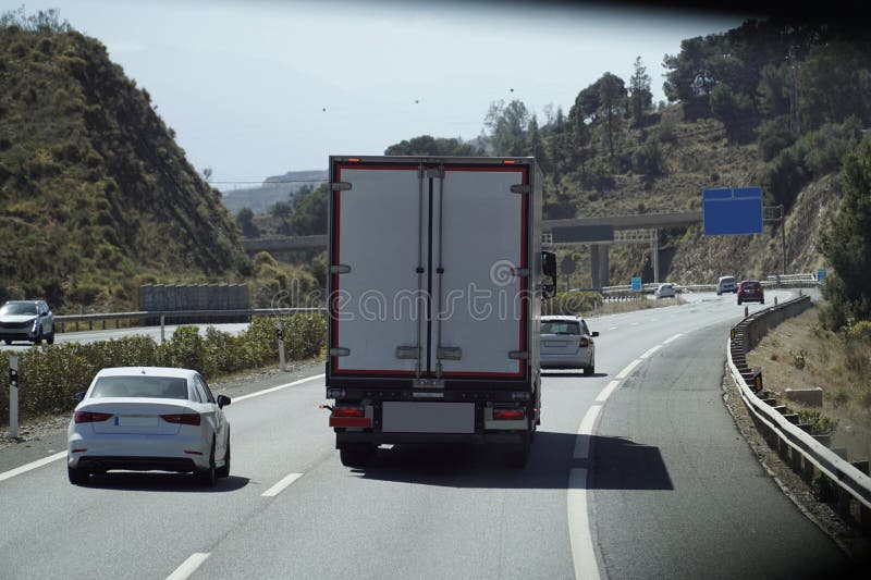 Truck on a Highway - Back View Stock Photo - Image of logistics ...
