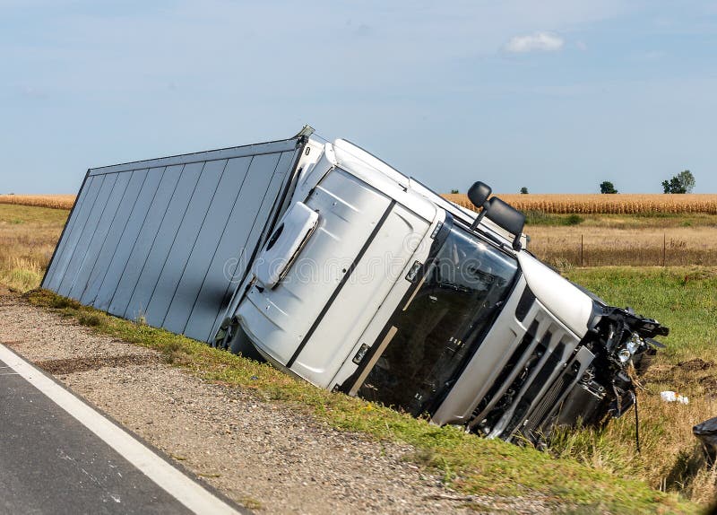 The Truck Lies in a Side Ditch after the Road Accident. Stock Photo ...