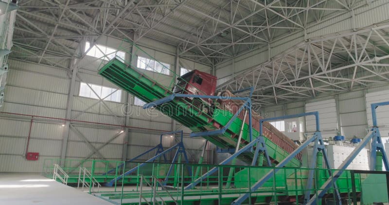 A Truck is Lifted on a Platform for Unloading Grain. Unloading Wheat ...