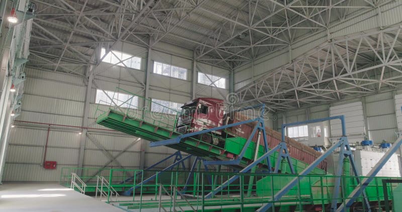 A Truck is Lifted on a Platform for Unloading Grain. Unloading Wheat ...