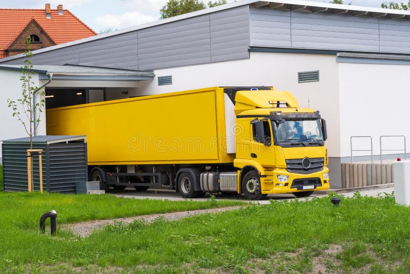 A Truck at the Loading Bay Delivers Goods To Stock Photo - Image of ...