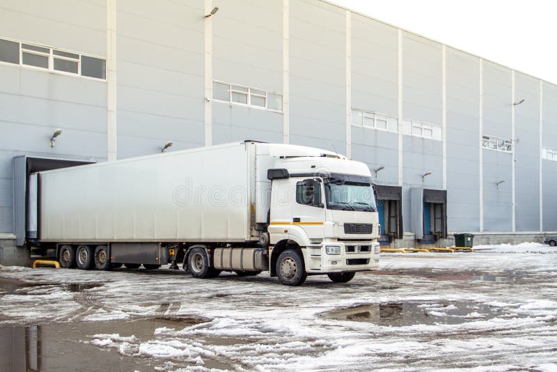 Truck while Loading in a Big Distribution Warehouse Stock Image - Image ...