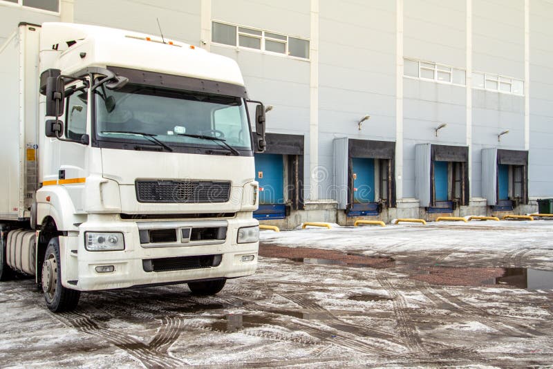 Truck while Loading in a Big Distribution Warehouse with Gates for for ...