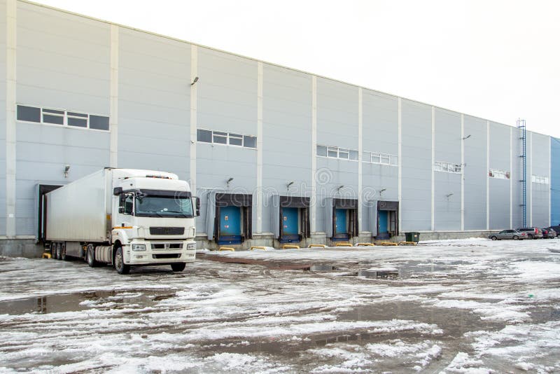 Truck while Loading in a Big Distribution Warehouse with Gates for for ...
