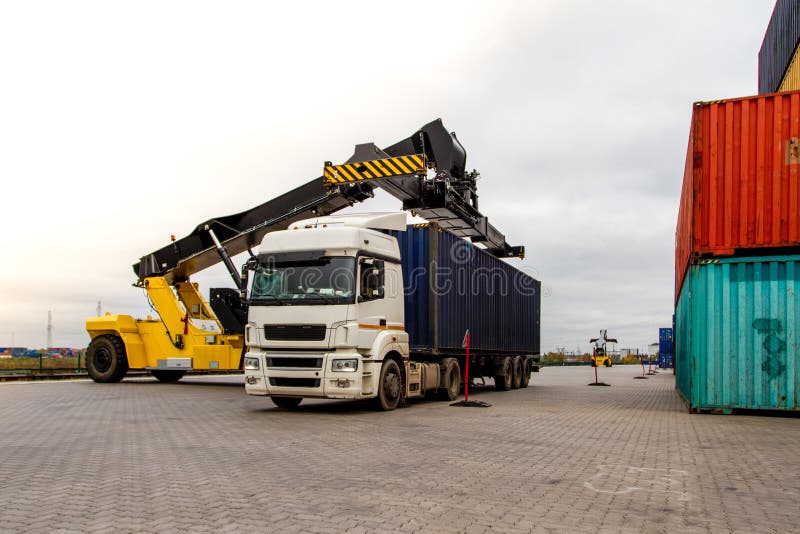 Truck while Loading in Logistic Shipping Yard with Cargo Container ...