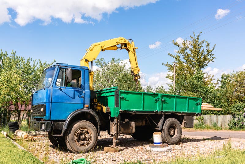 Truck. Manipulator Jib with Big Heavy Hook. Load and Unloading Machine ...