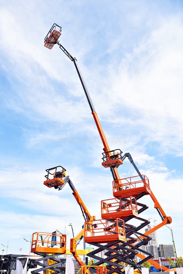 Cranes with cradles on sky stock photo. Image of equipment - 256557240