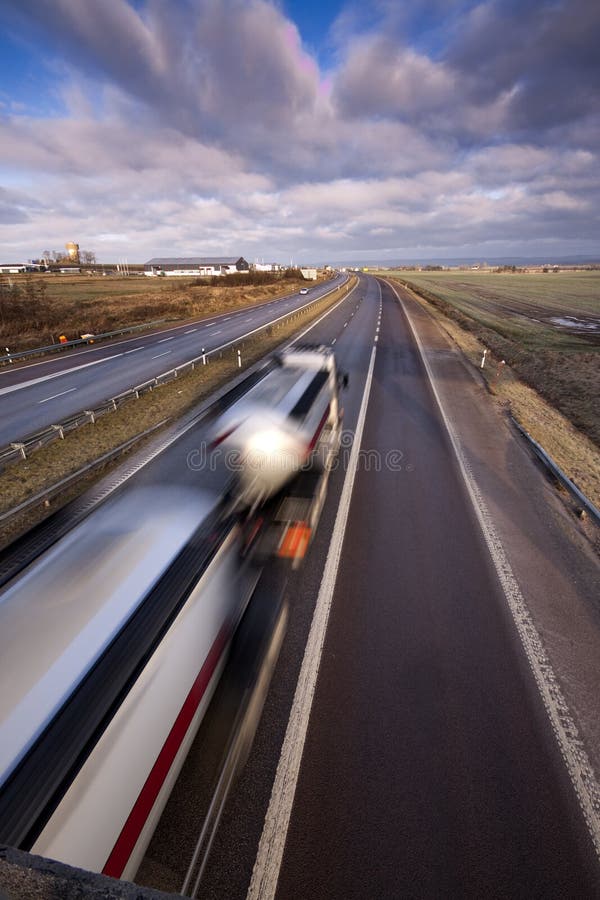 Truck moving fast. stock photo. Image of thoroughfare - 12403024