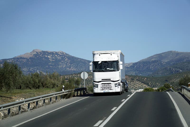 Truck on a Road - Front View, Mountains on Second Plan Stock Photo ...