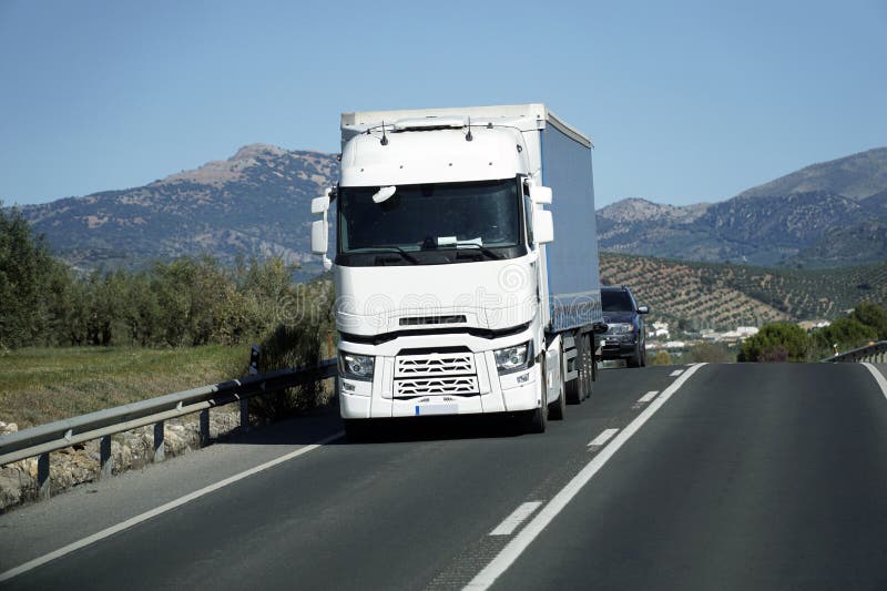 Truck on a Road - Front View, Mountains on Second Plan Stock Photo ...
