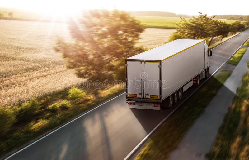 Truck on a Road at Full Speed Stock Photo - Image of cargo, driving ...