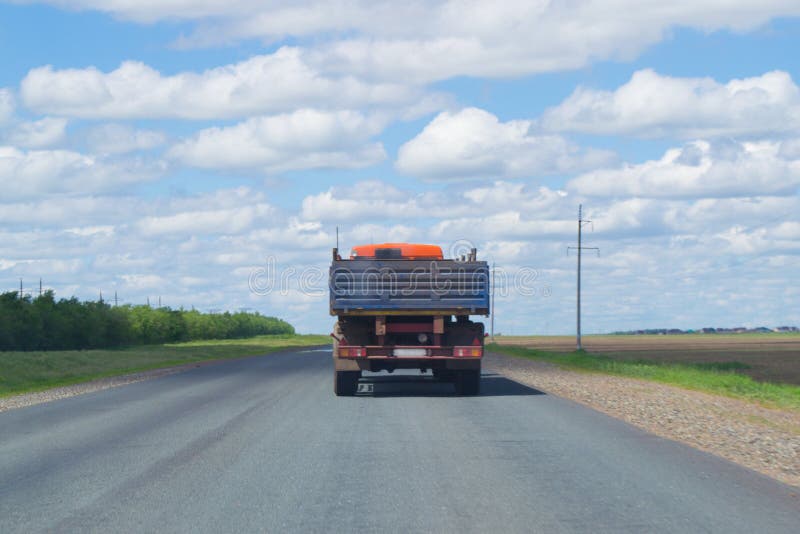 Truck Runs on Highway Under the Blue Sky Stock Photo - Image of ...