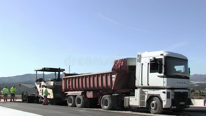 Truck with Trailer Assembling To Asphalt Paver Stock Video - Video of ...