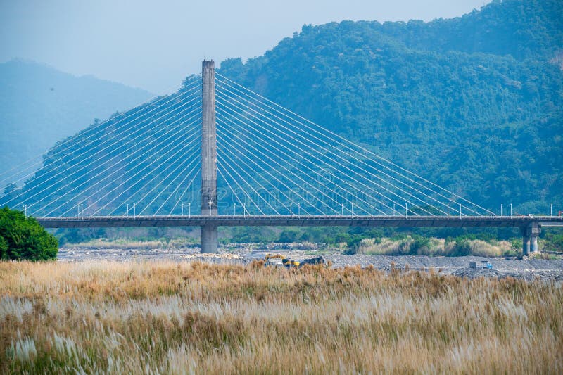 The Truck Travels Along the River Bed. Jilu Bridge (cable-stayed Bridge ...