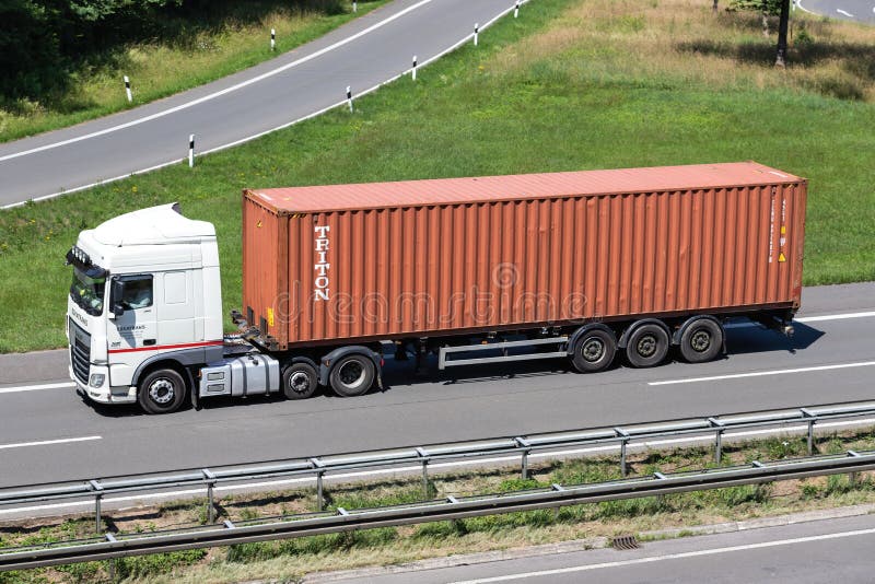 Truck with Triton Container on Motorway Editorial Photo - Image of feet ...