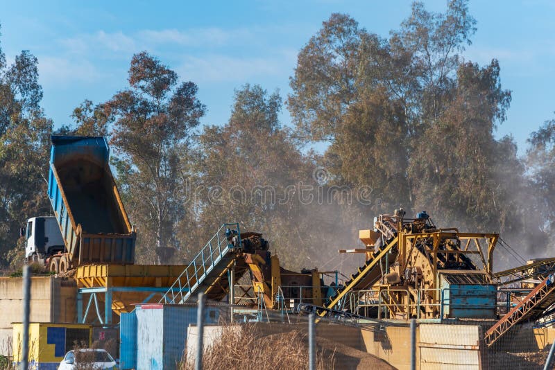 Truck Unloading Stones into the Hopper of a Quarry Stock Image - Image ...