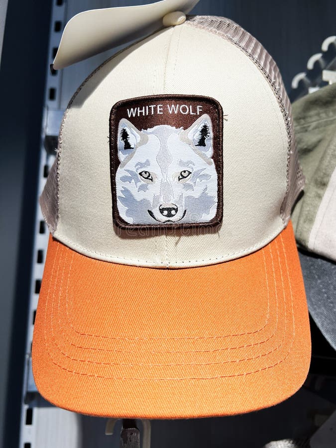 Trucker Cap with Orange Front and White Wolf Design Patch on Display ...