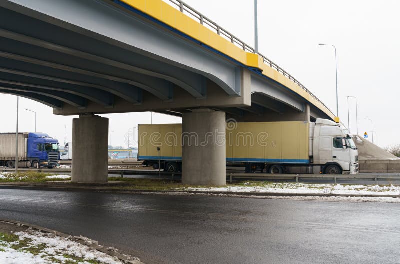 Trucks Drive Under the Transport Bridge. Transport Logistics Stock ...