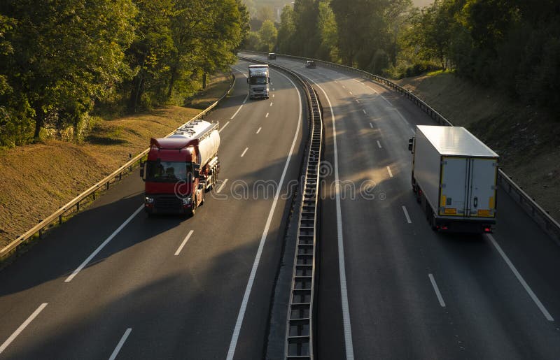 Trucks Driving on the Highway Stock Photo - Image of logistic, carrying ...