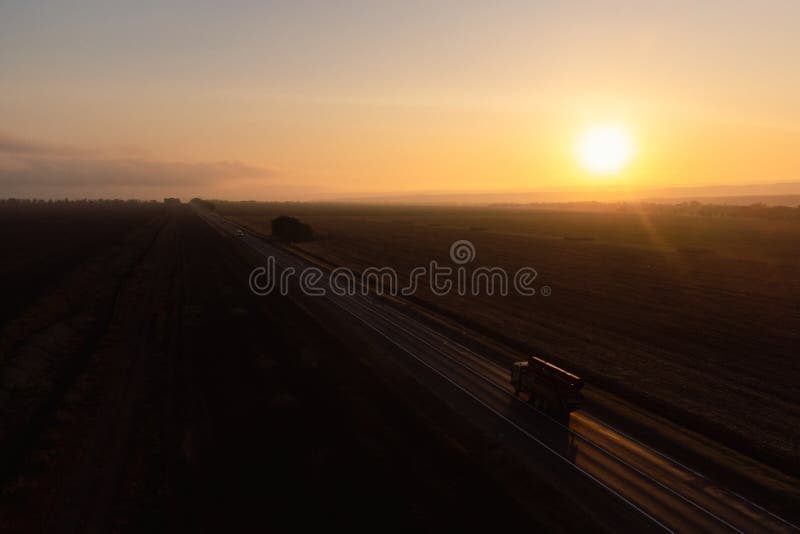 Trucks are Driving on the Road at Sunset Stock Image - Image of highway ...