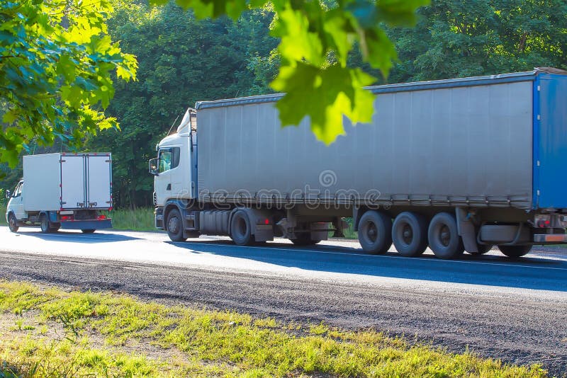 Trucks go on highway stock photo. Image of automobile - 68774192