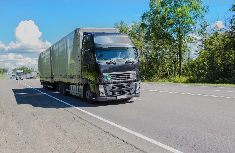 Trucks Goes on Highway in Evening Stock Image - Image of delivering ...