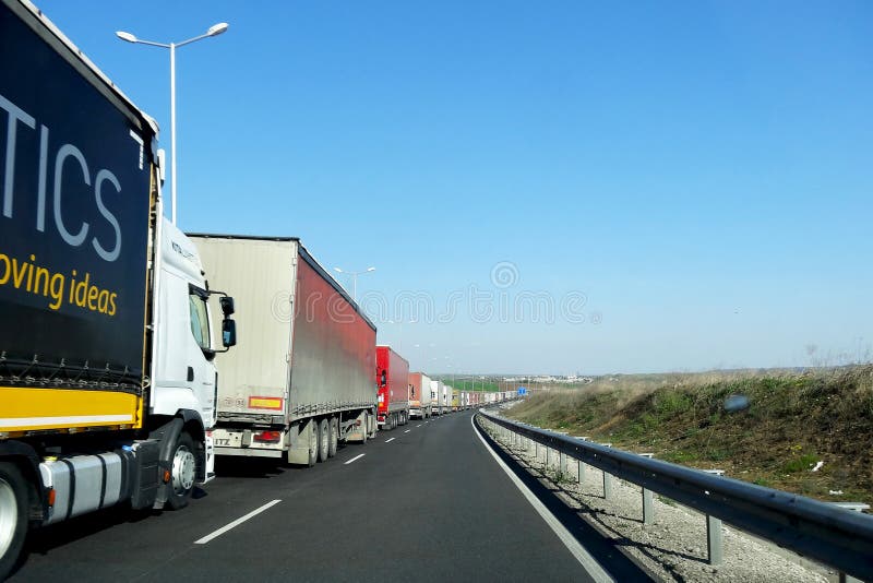 Trucks on Highway in a Queue Stock Photo - Image of marks, road: 85558088
