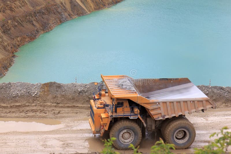 Trucks in open pit stock image. Image of large, iron - 40569699