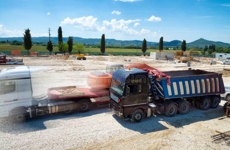 Trucks Operating in Construction Building Site Stock Photo - Image of ...