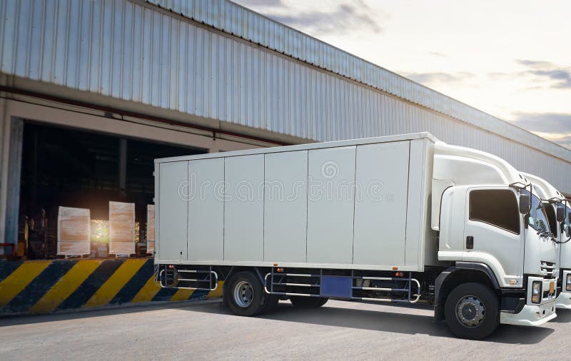 Trucks Parked Loading at Dock Warehouse. Package Boxes Pallets, Cargo ...