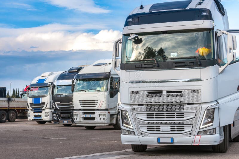 Trucks in a parking lot stock photo. Image of commercial - 164168632
