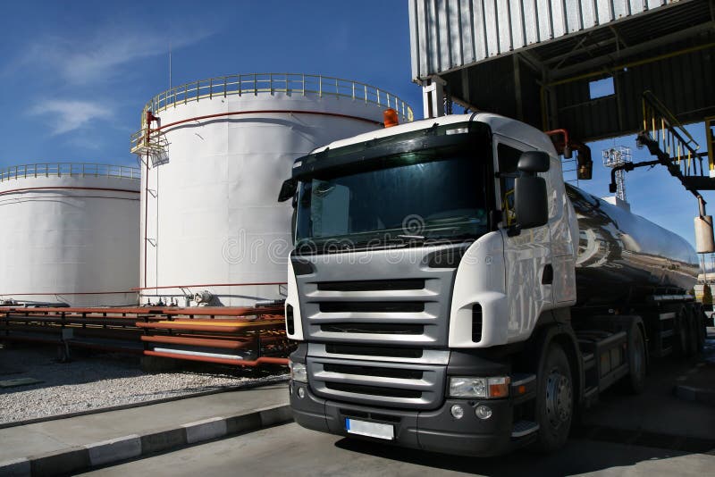 Trucks and refinery stock image. Image of tank, generation - 14868695
