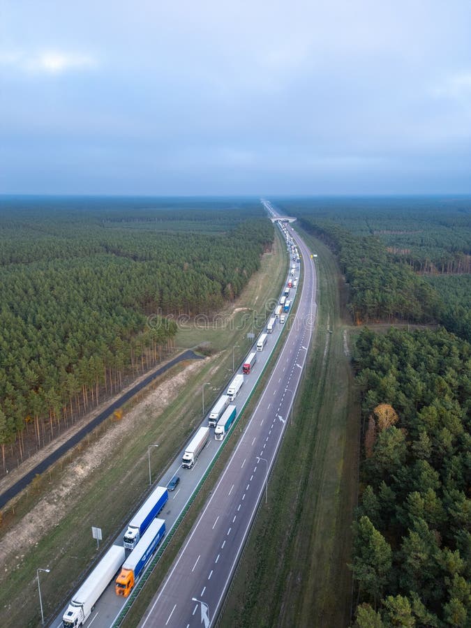 Trucks on a Road through a Wooded Area Editorial Stock Image - Image of ...