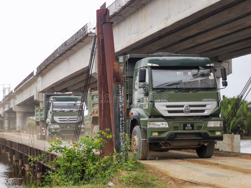 Trucks on Temporary Bridge. Construction of a Fly Over Bridge Road ...