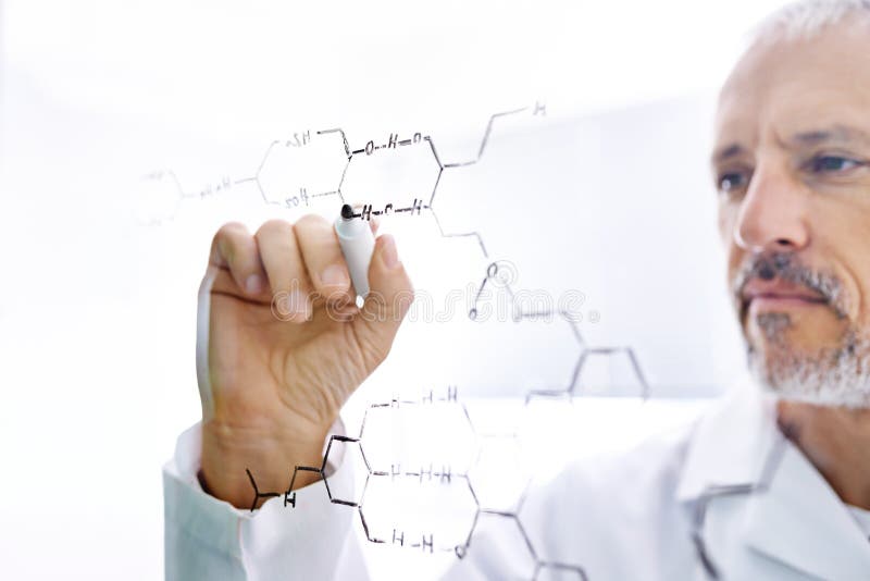 True Genius at Work. a Mature Male Scientist Drawing the Structures of ...