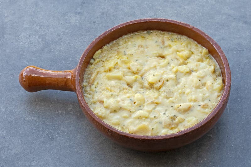 Truffade dish on a table stock photo. Image of cuisine - 219235716
