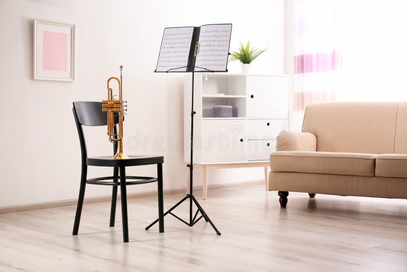 Trumpet, Chair and Note Stand with Music Sheets Stock Image - Image of ...