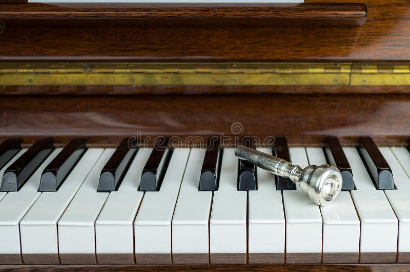 Trumpet Mouthpiece upon the Piano Keys, Close Up Stock Image - Image of ...