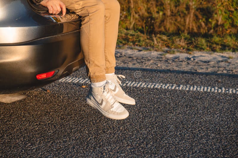 The Trunk of a Car is Full of Man Whose Legs are Sticking Out. Taking a ...
