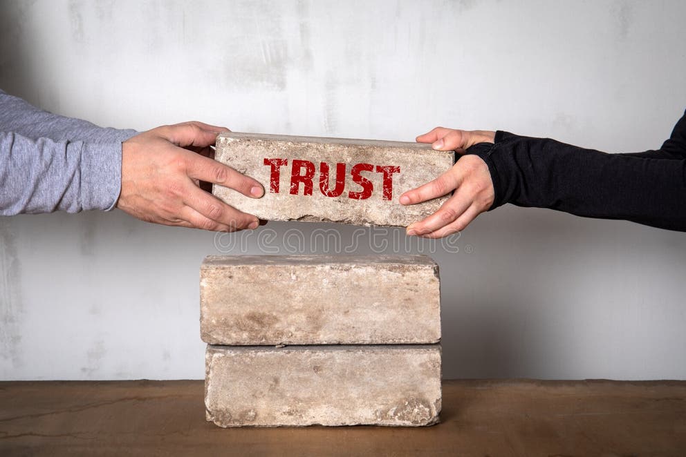 Trust Concept. White Brick Stack on a Wooden Table Stock Photo - Image ...