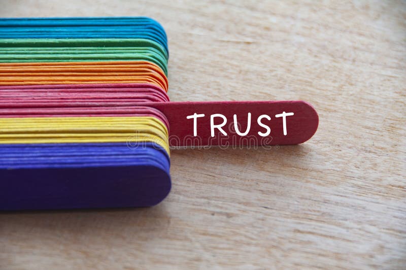 Trust Text on Red Wooden Stick Sticking Out from the Rest of the Sticks ...