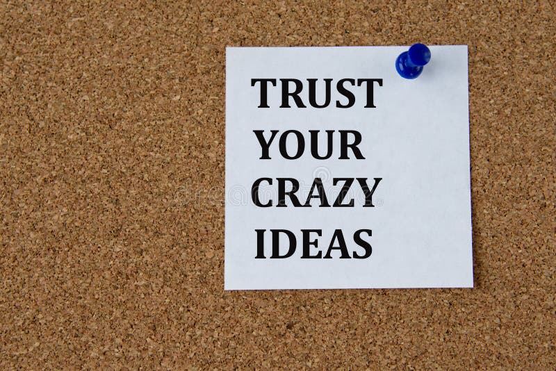 TRUST YOUR CRAZY IDEAS - Words on a White Sheet of Paper Attached To a ...