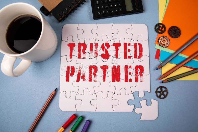 Trusted Partner. White Puzzle and Office Supplies on Table Stock Photo ...