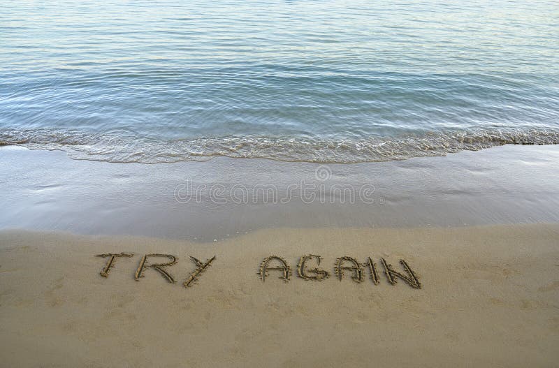 Try Again Written in the Sand on the Beach with the Sea Washing Up the ...