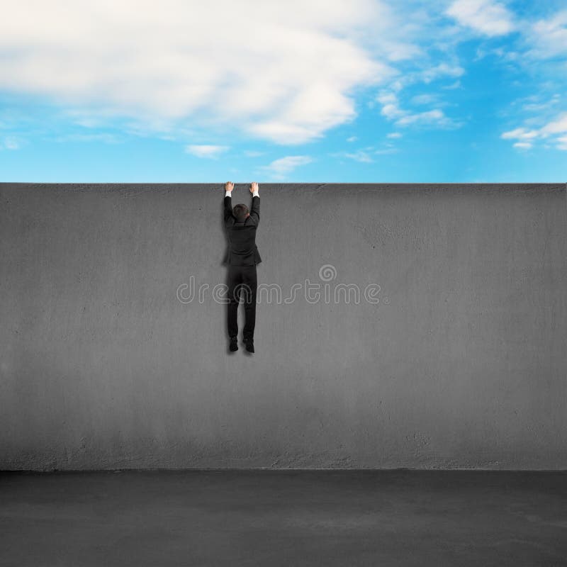 Trying To Climb Over Wall with Blue Sky Background Stock Photo - Image ...