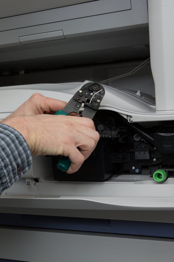 Trying To Repair the Office Printer at Work Stock Photo - Image of ...
