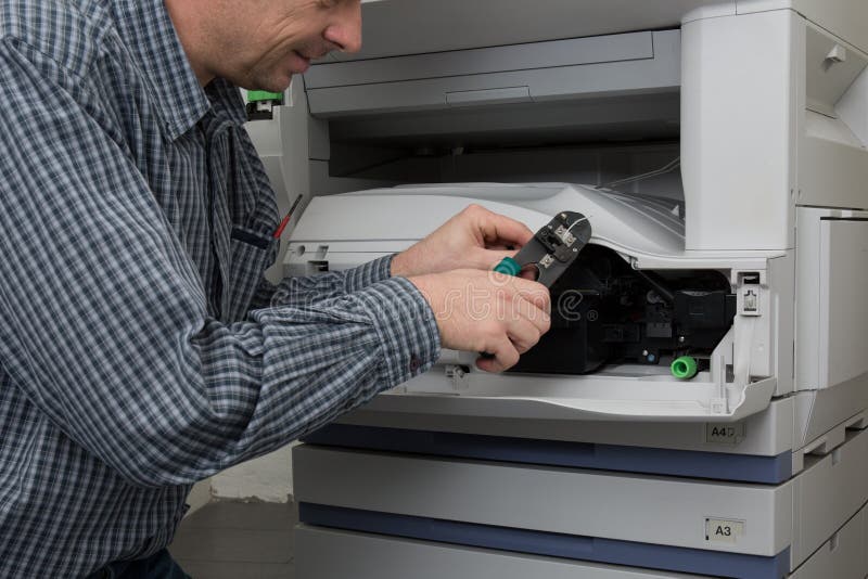 Trying To Repair the Office Printer at Work Stock Image - Image of ...